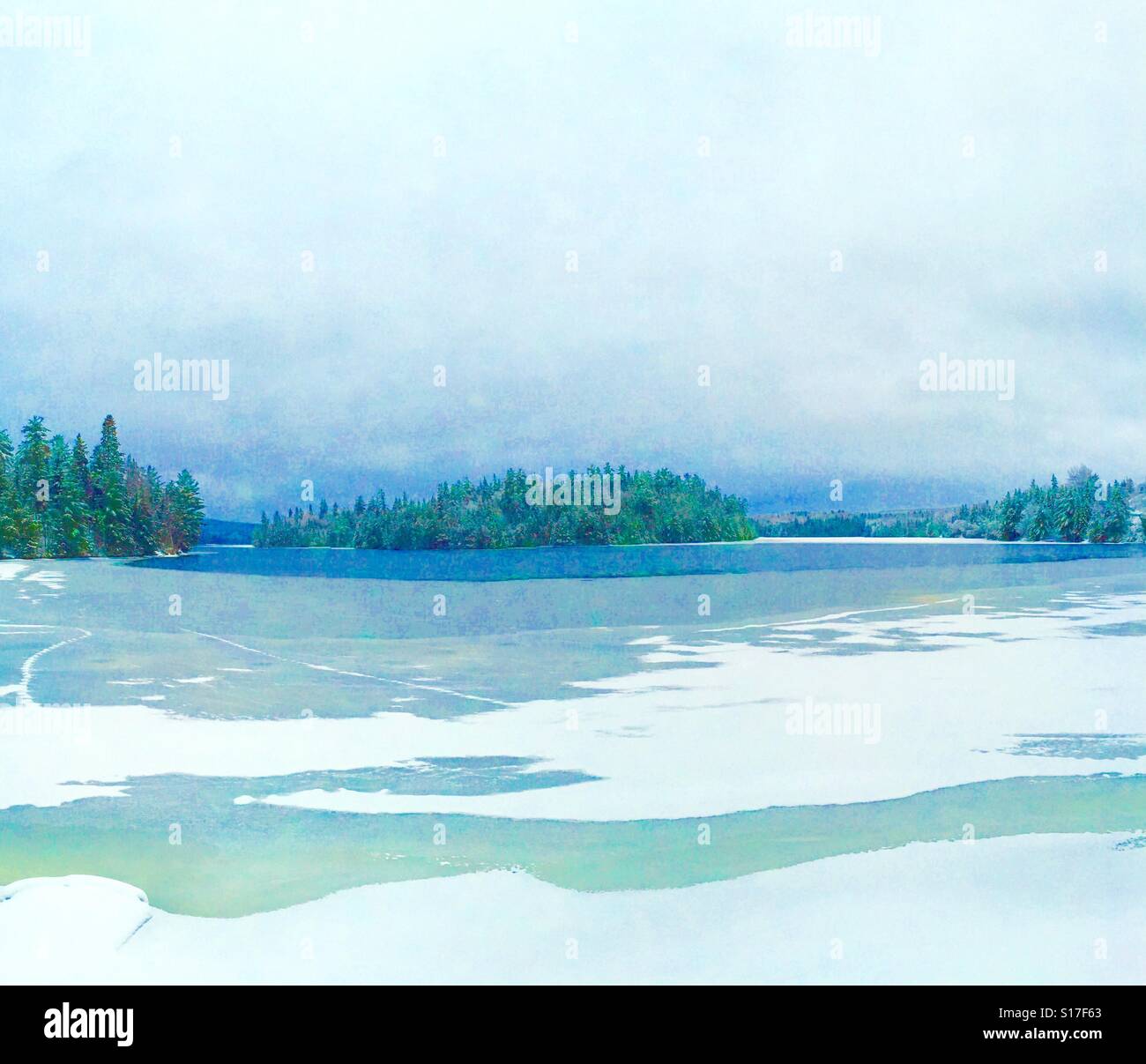 Lake Freezing Over At Forest Stock Photo - Alamy