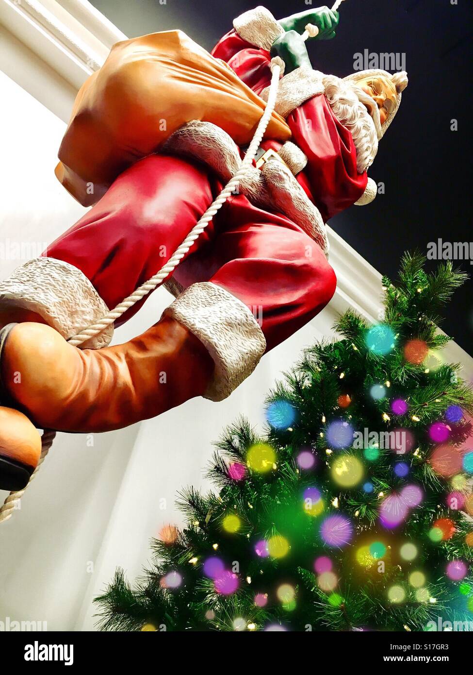 Santa coming down rope Stock Photo - Alamy