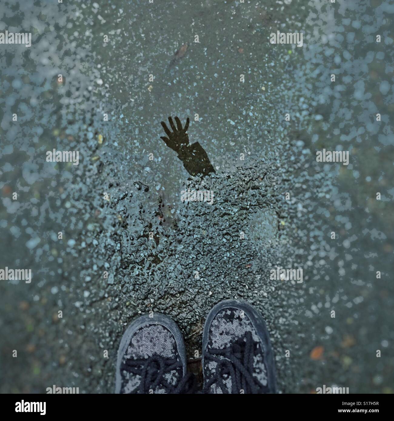 Feet and hand shadow Stock Photo - Alamy
