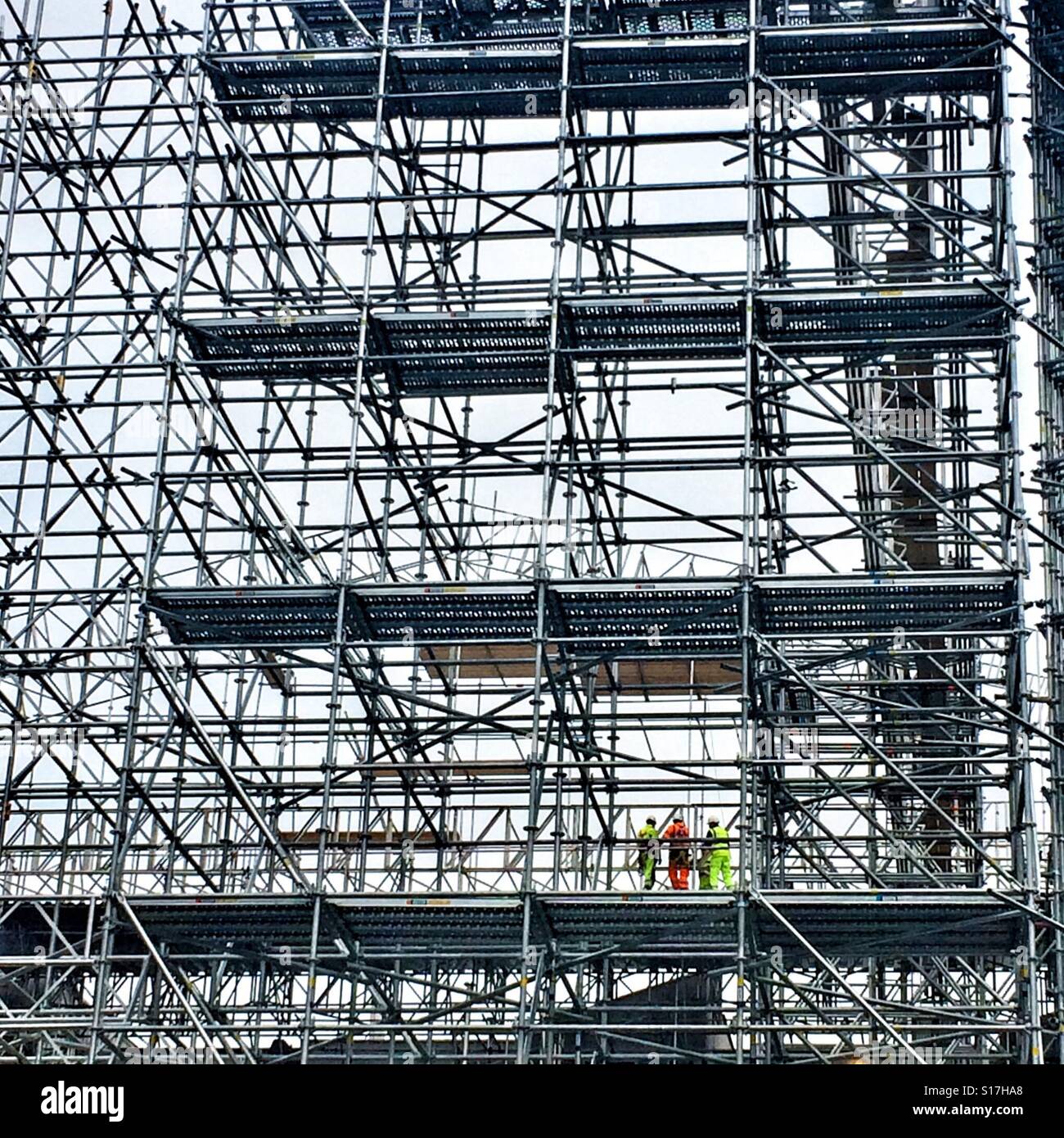Workmen on a building scaffold Stock Photo - Alamy