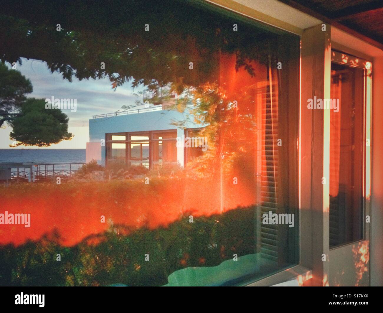 A reflection of sunrise on a balcony Stock Photo - Alamy