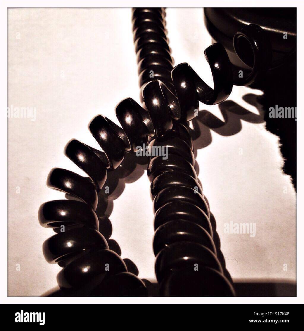 Vintage black telephone detail showing telephone cord Stock Photo - Alamy