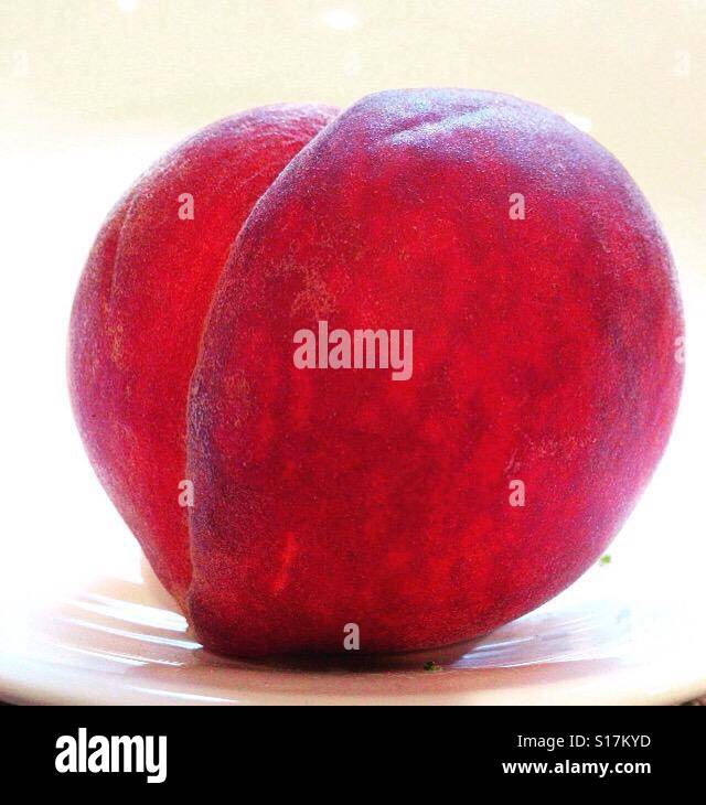 Close-up side view of a red summer peach Stock Photo - Alamy