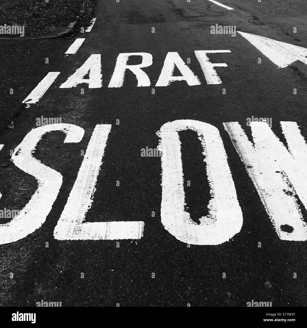 Araf-Slow road markings in Wales UK Stock Photo - Alamy