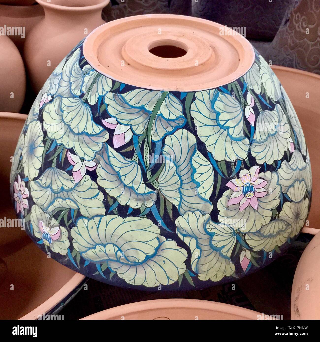 Thai pottery with lotus flower motifs hi-res stock photography and ...