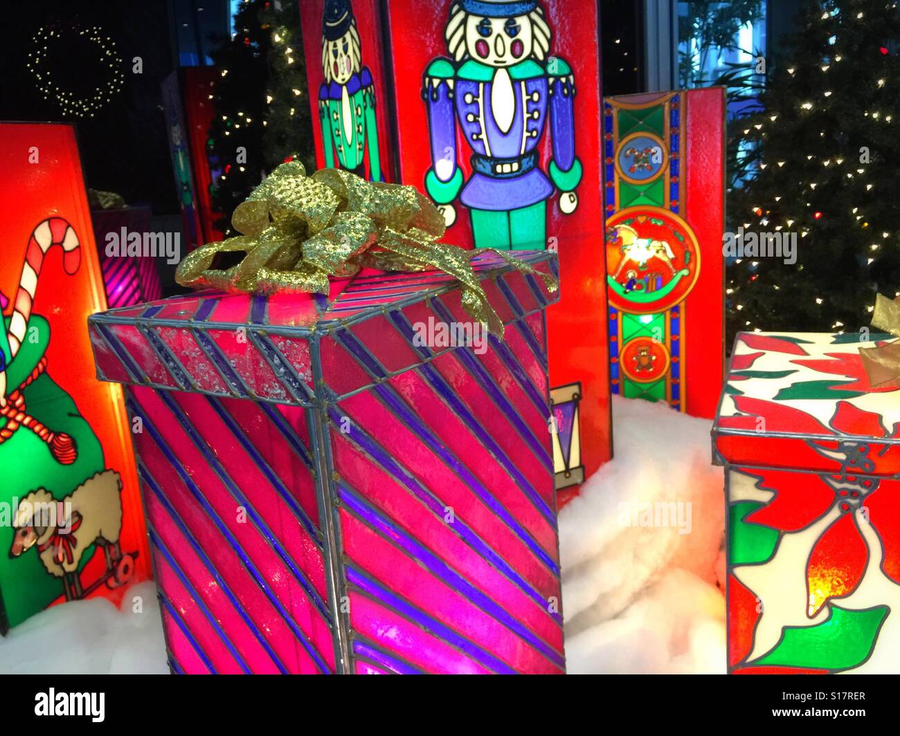 Colorful lighted holiday wrapped presents made from stained leaded ...