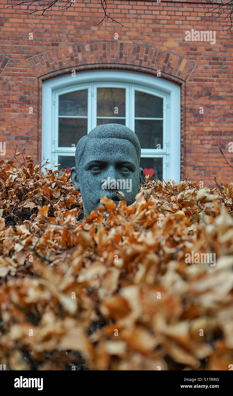 Statue and leaves hi-res stock photography and images - Alamy