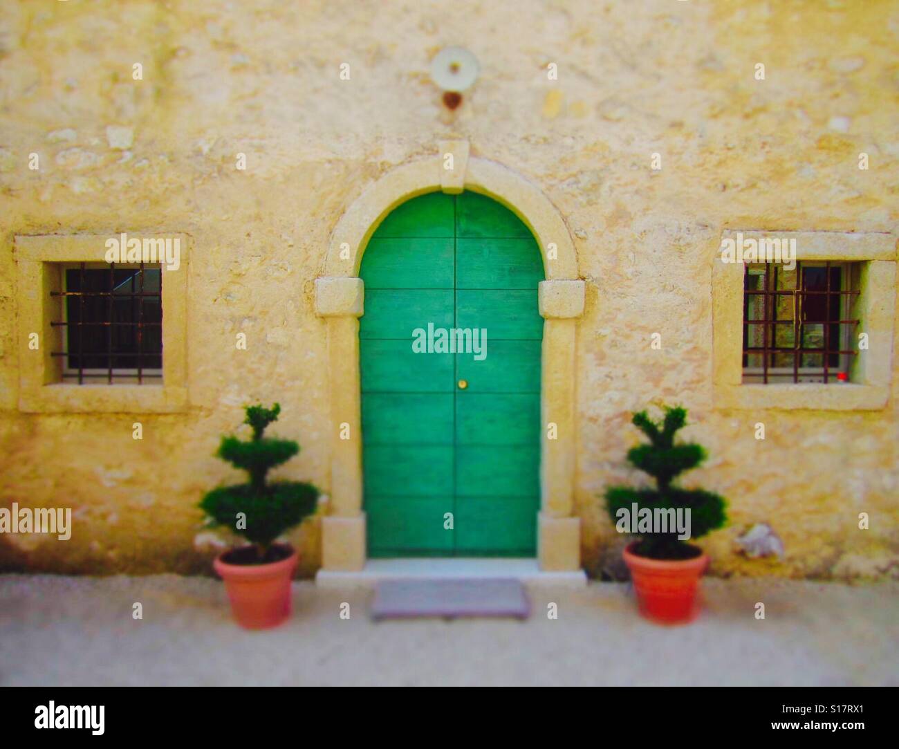 Rustic green doorway on old Italian country home Stock Photo - Alamy