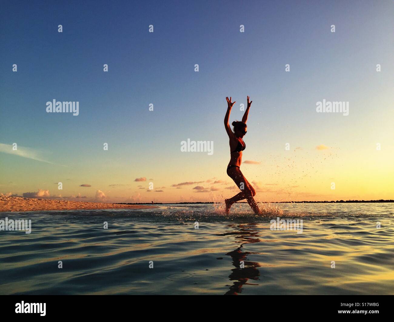 Women sunset jumping hi-res stock photography and images - Alamy
