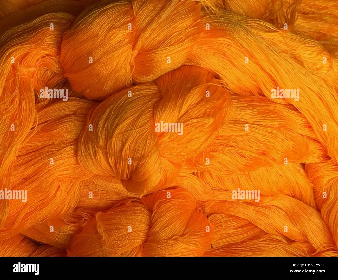 Thai orange threads for temple offering , Phrae province, Thailand ...