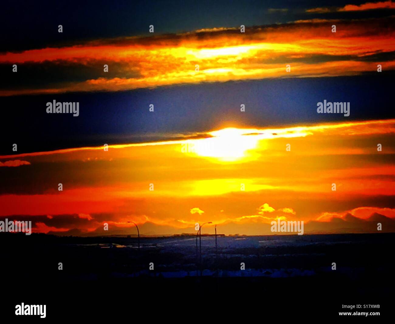 Chinook arch and sunset over the Canadian Rockies. View from the City ...