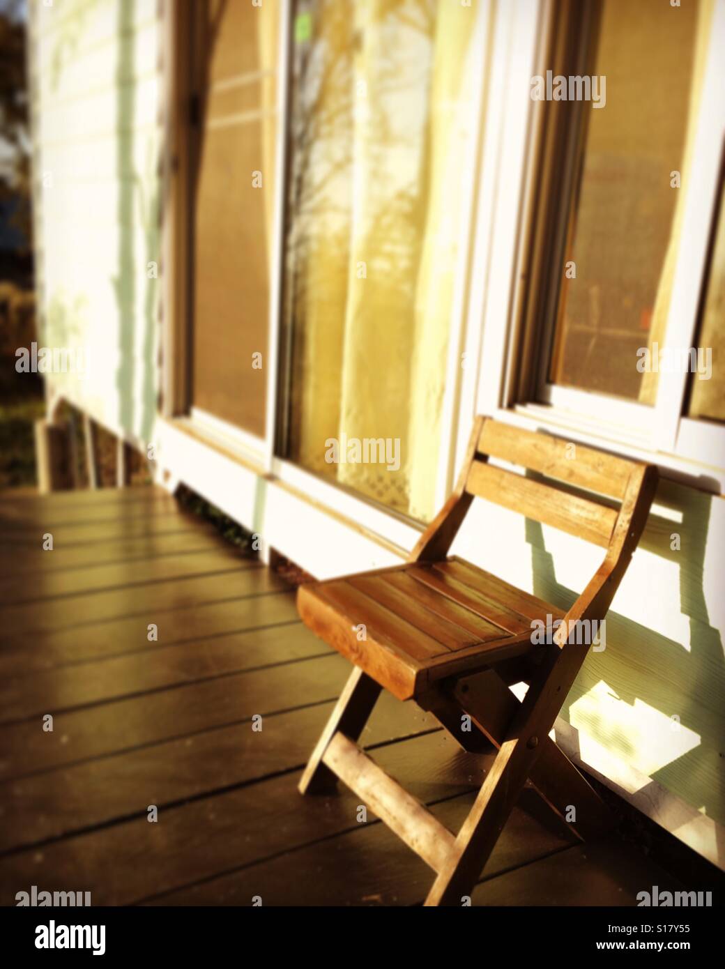 A lonely chair at the corridor in the evening sunlight Stock Photo - Alamy