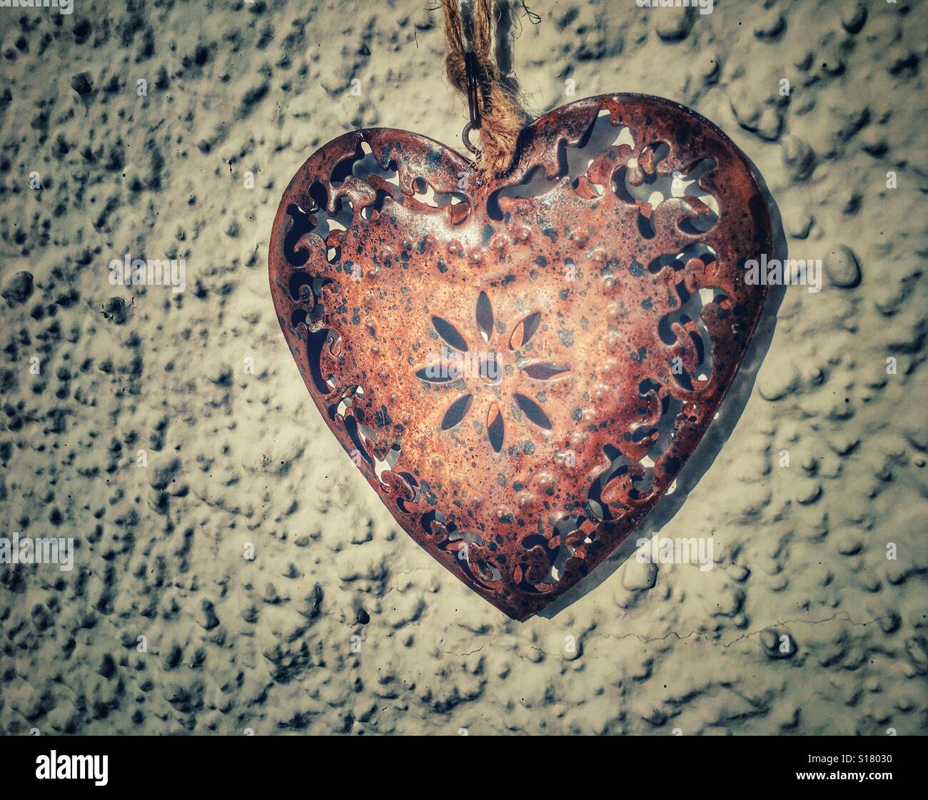 Rusty heart shaped decoration against white rustic wall Stock Photo - Alamy
