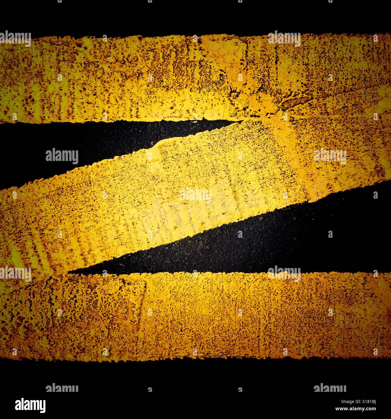 Yellow road markings in the shape of the letter Z Stock Photo - Alamy