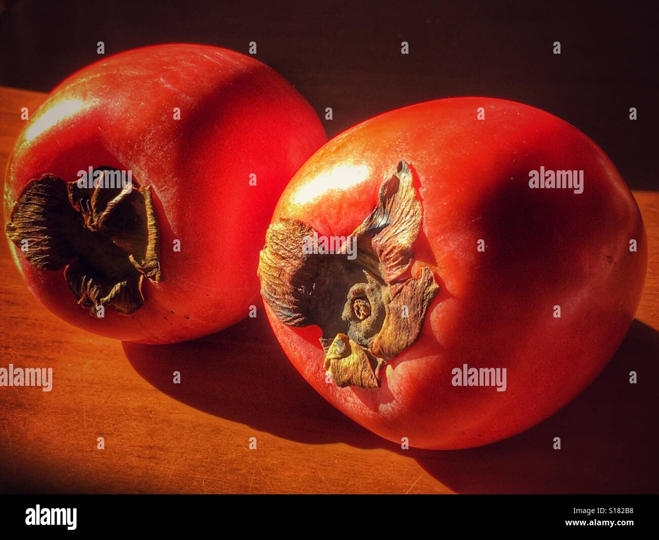 Two persimmons hi-res stock photography and images - Alamy