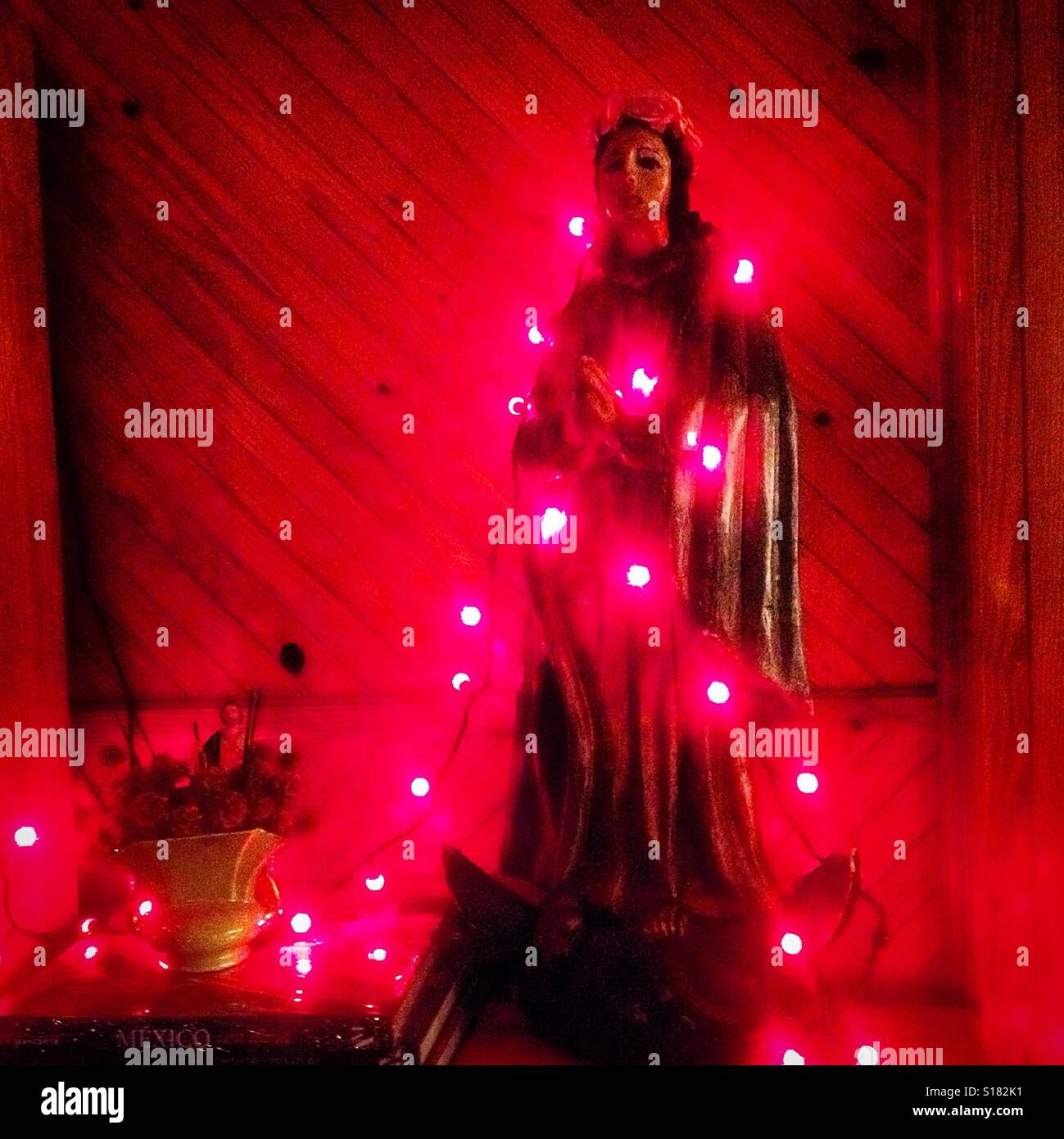 An image of Our Lady of Guadalupe decorated with red lights in Mexico ...