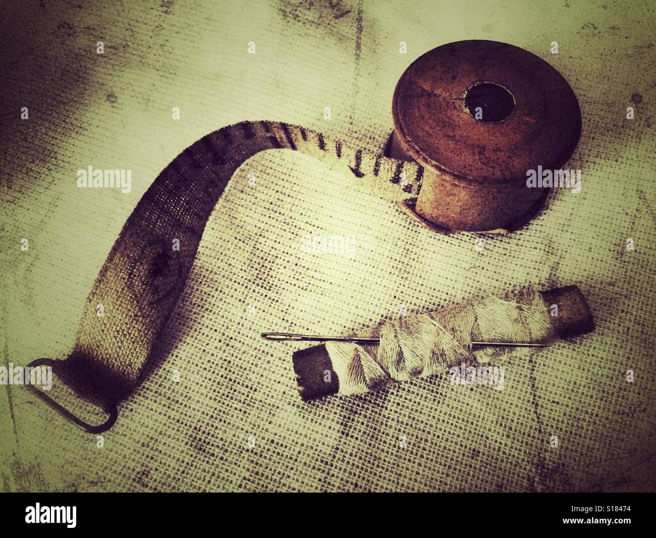Antique tape measure, needle and thread Stock Photo - Alamy