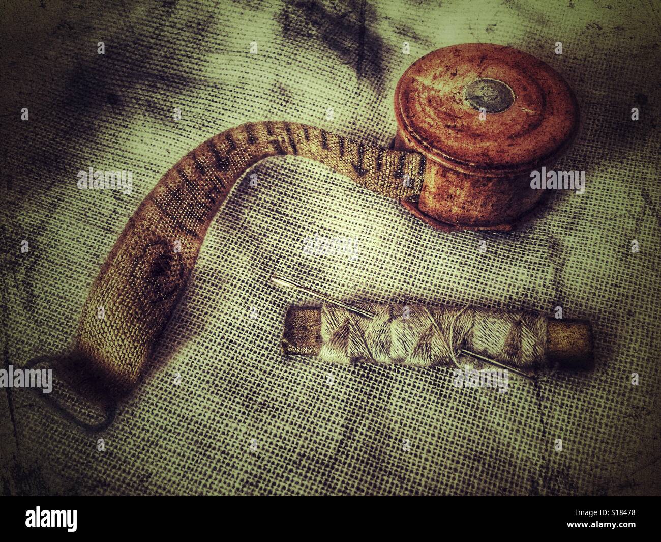 Vintage tape measure, needle and thread Stock Photo - Alamy