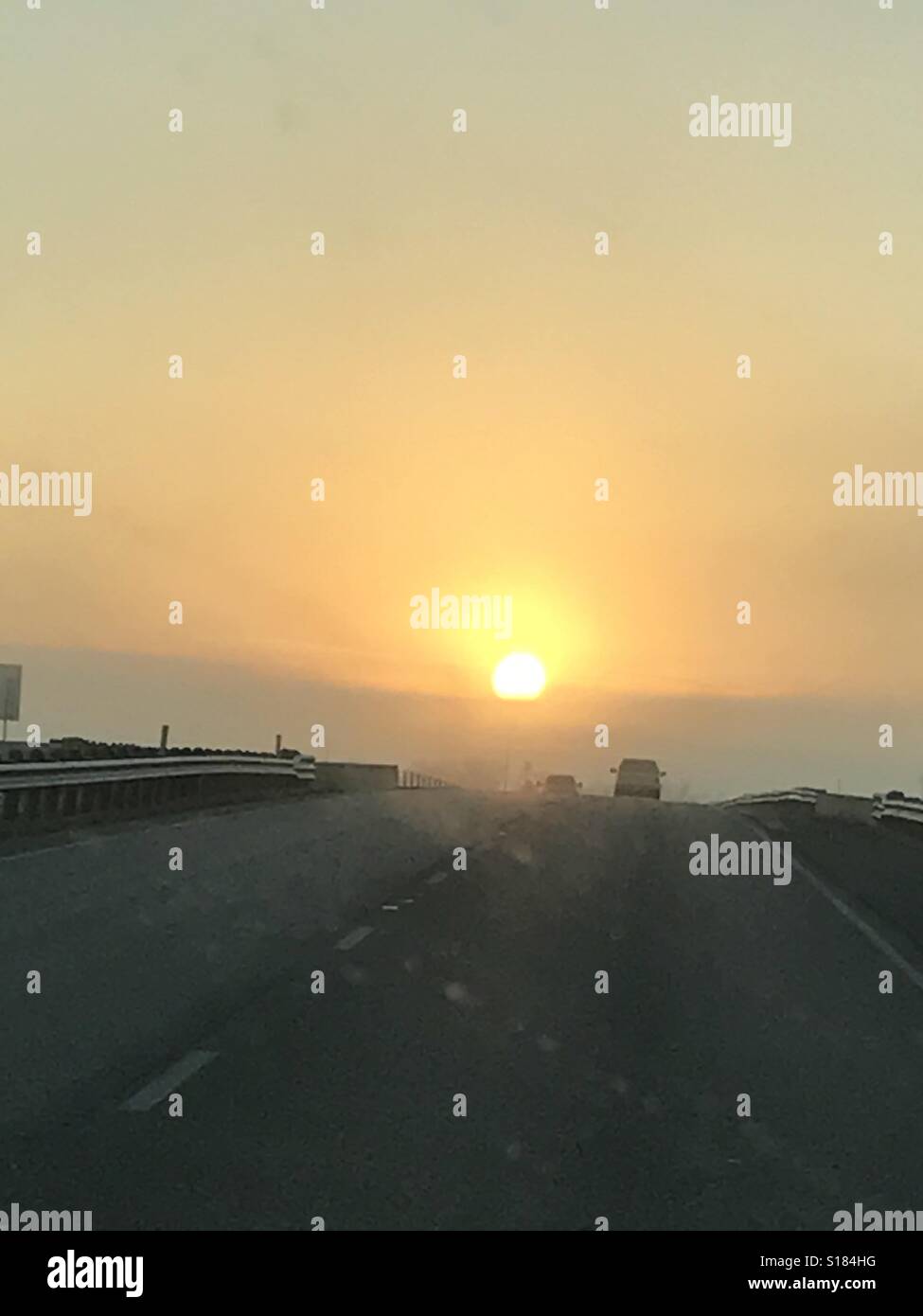 Sunrise over highway Stock Photo - Alamy