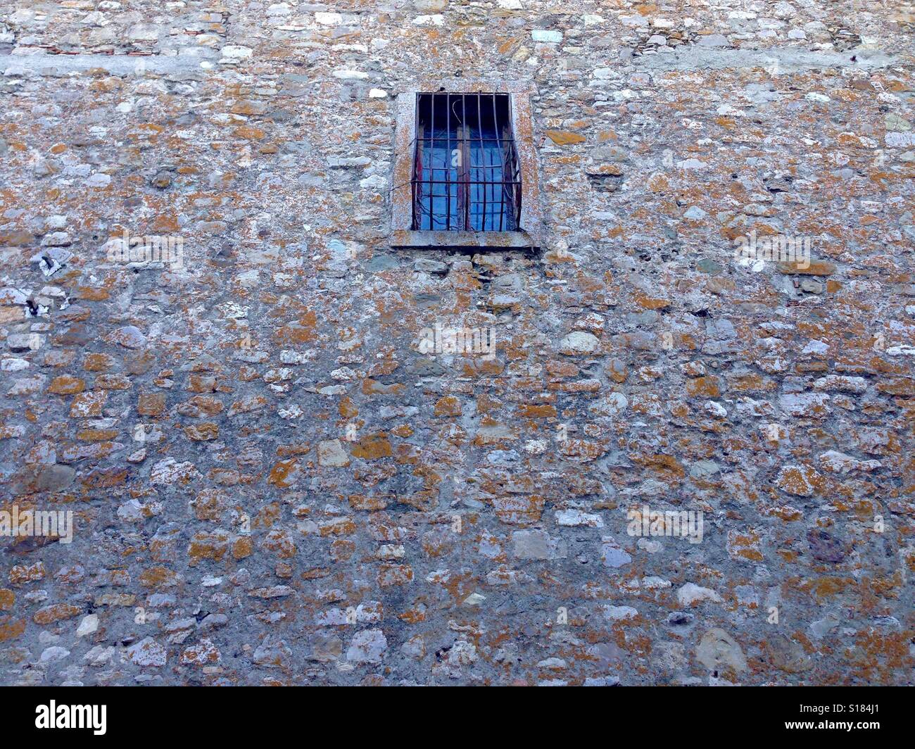 A window in the wall of a medieval castle in south Italy Stock Photo ...