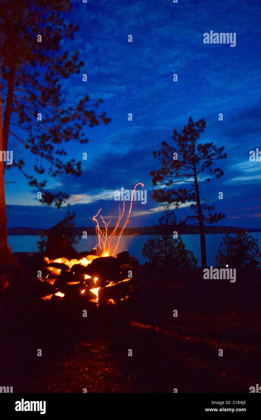 Dark Blue Sky With Lake Campfire Stock Photo - Alamy