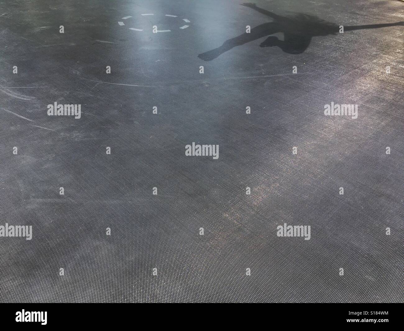 Shadow of a young girl jumping on a trampoline Stock Photo - Alamy