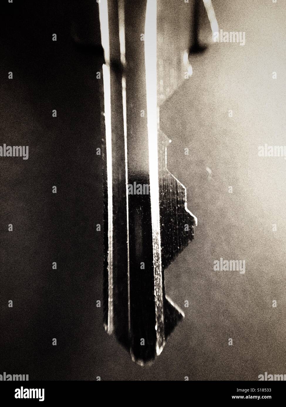 Silver residential house key Stock Photo - Alamy