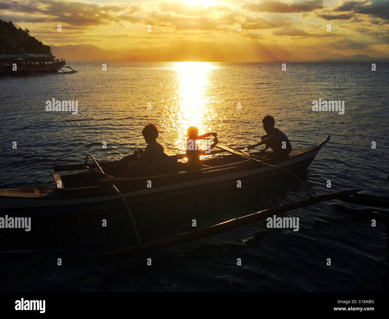 Kids fishing for a living Stock Photo - Alamy