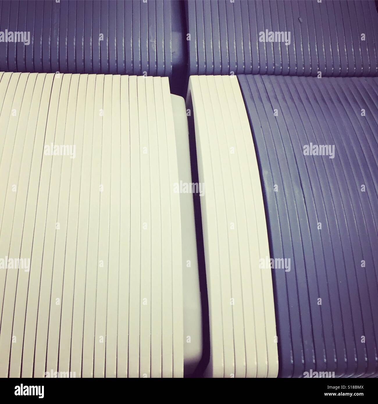 Stack of white and grey shoe trays by K.R Stock Photo - Alamy