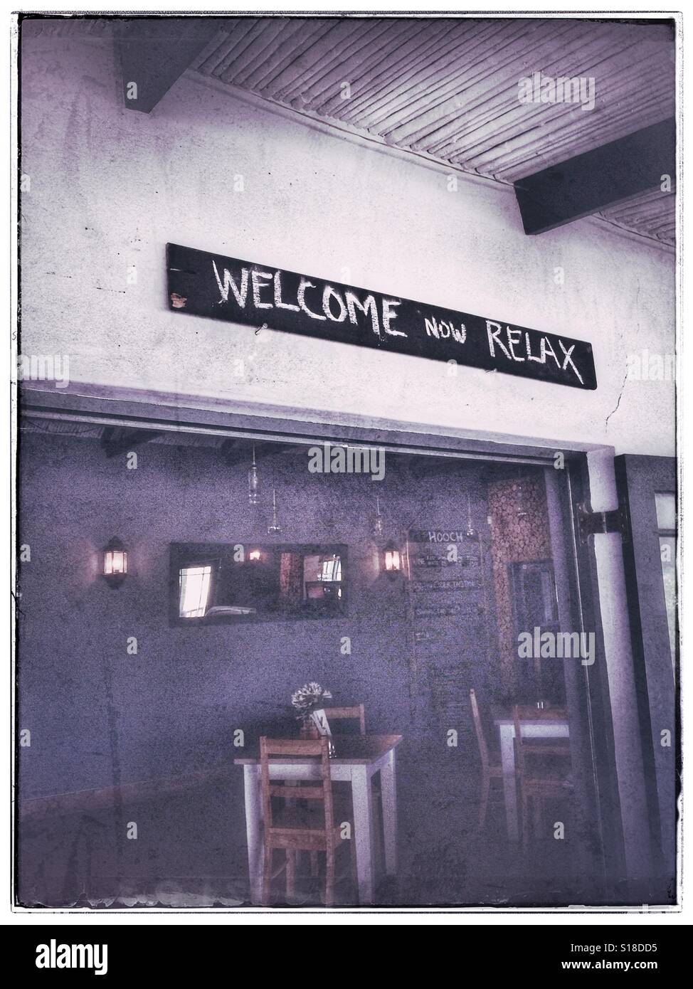 "Welcome and relax" sign at the Hickory Shack in Grabouw, South Africa ...