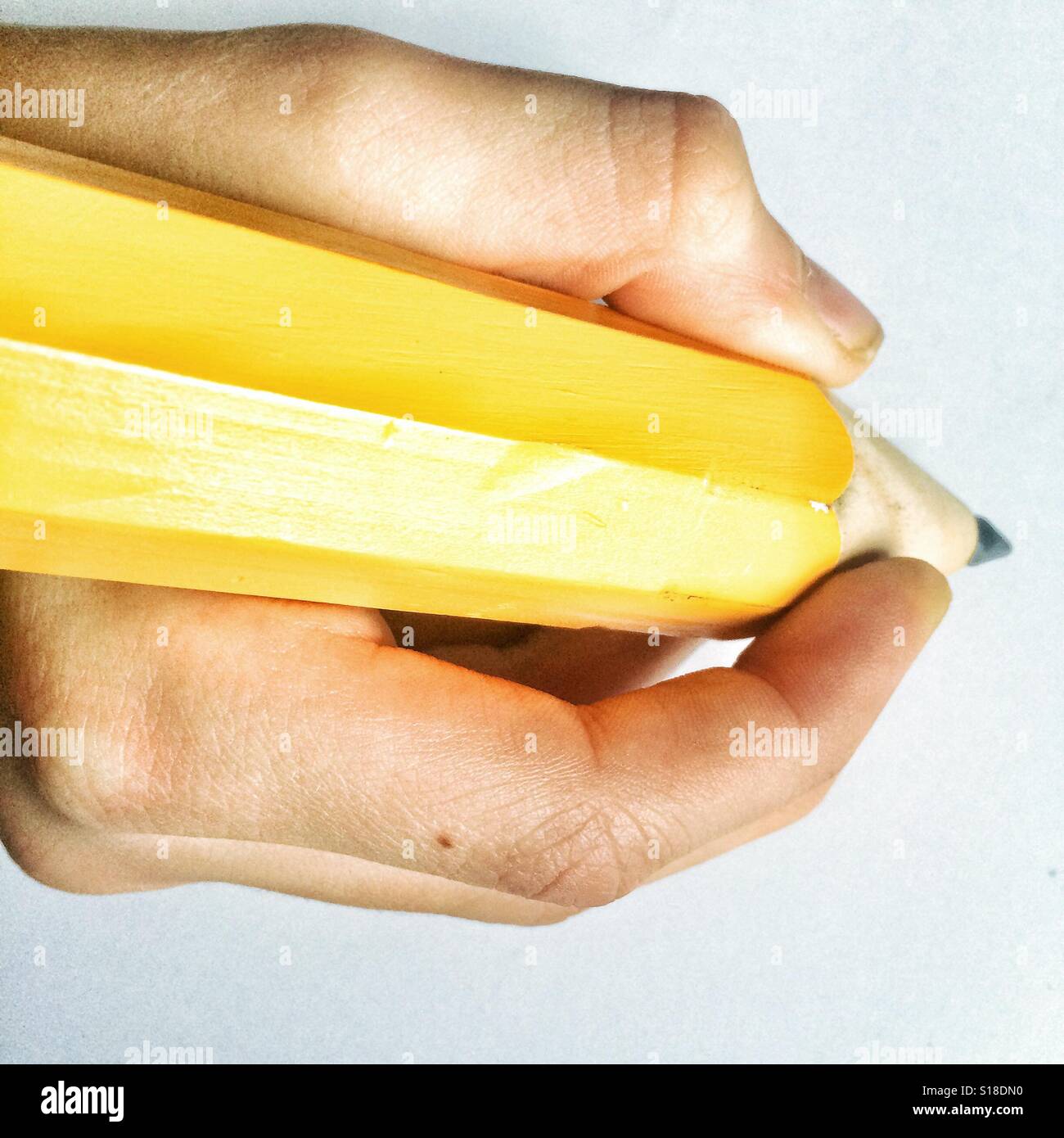 Writing with a giant pencil Stock Photo - Alamy