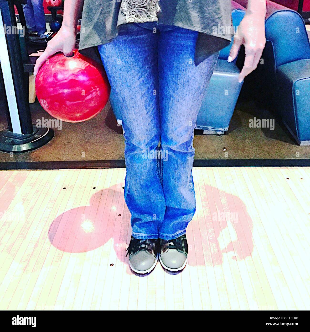 A quirky portrait of a woman ready to go bowling Stock Photo - Alamy