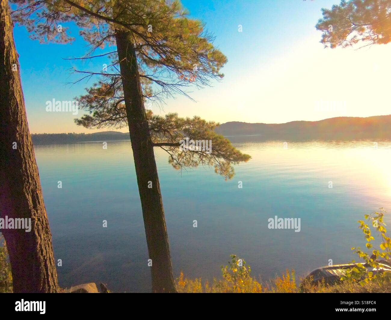 Sunny Calm Lake With Inflatable Kayak Portrait Stock Photo - Alamy