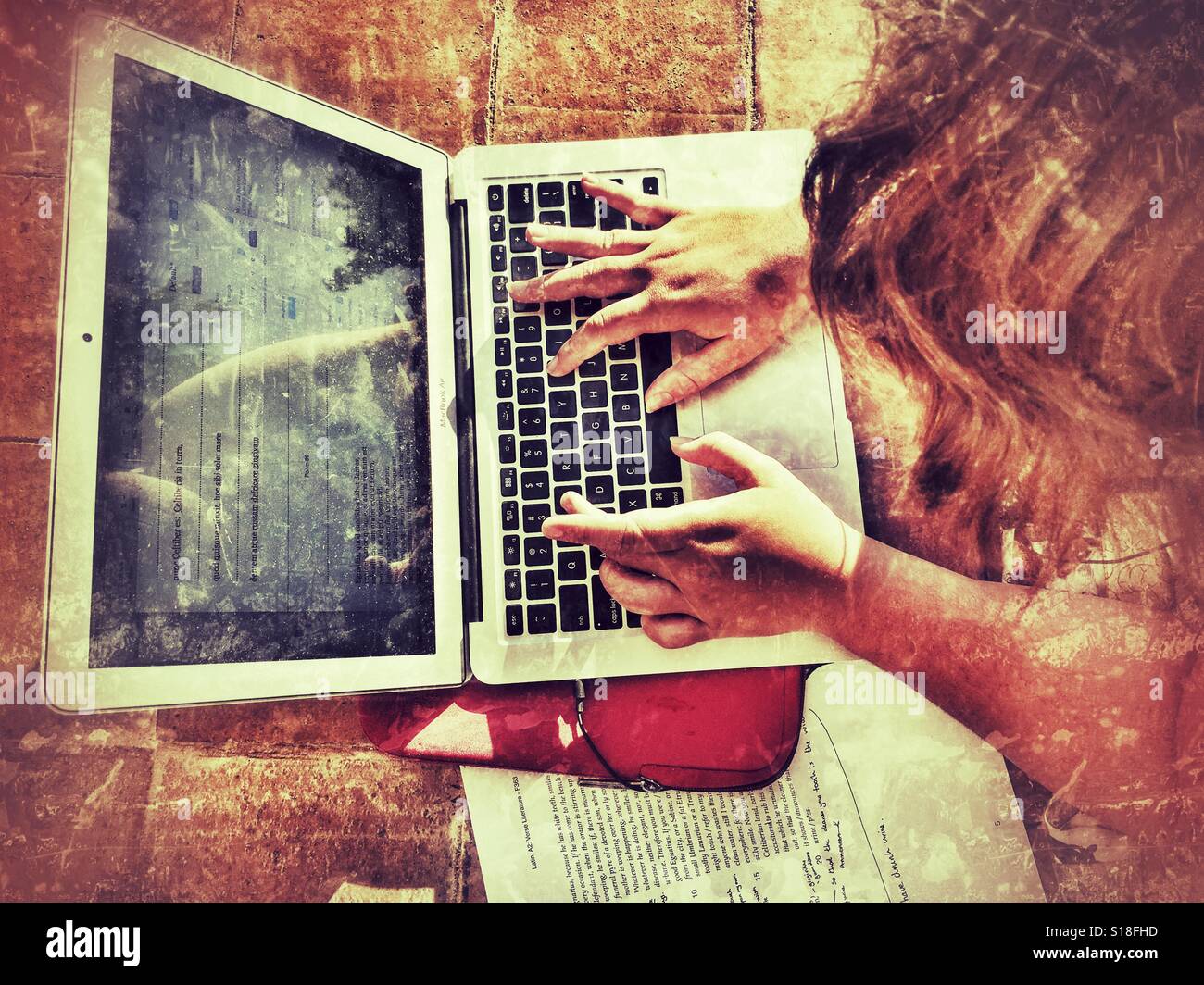 Teenage student revising, working at laptop, lying on the floor Stock ...