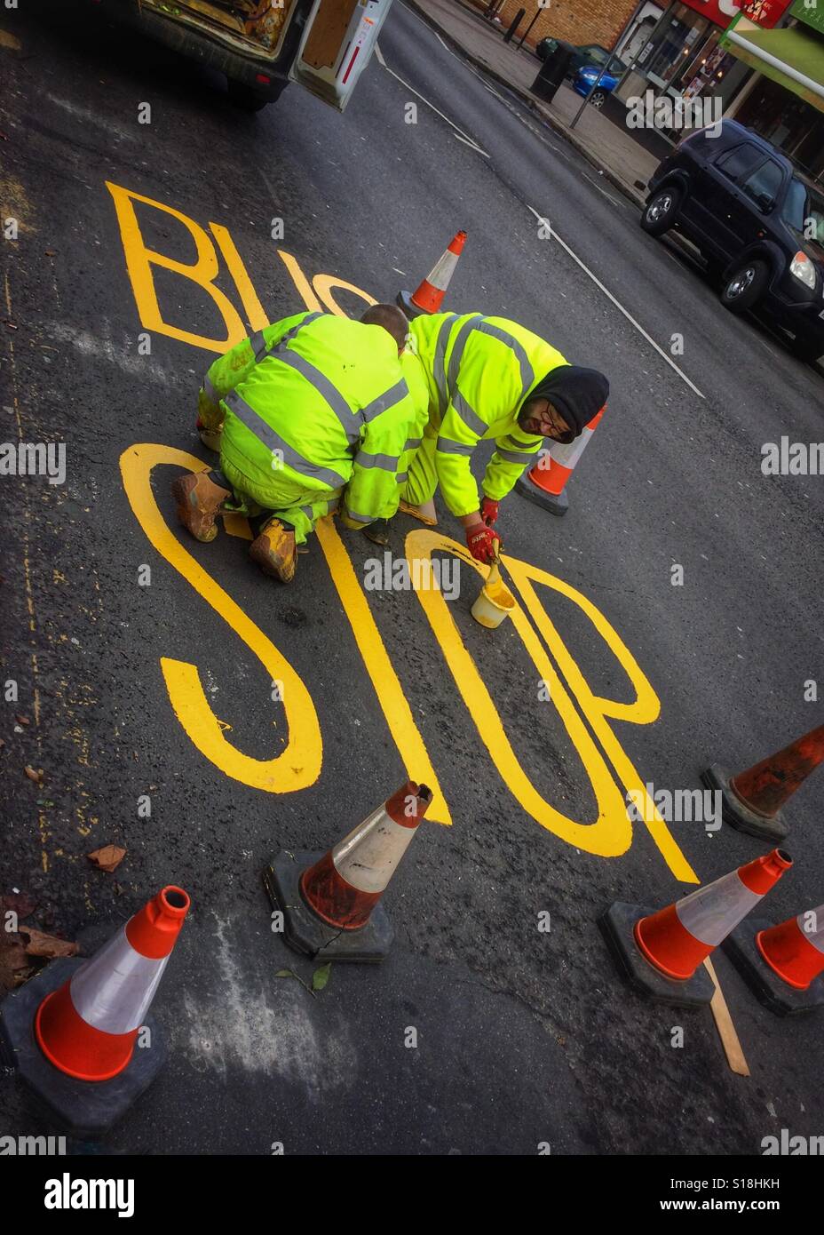 Painting the bus stop Stock Photo - Alamy