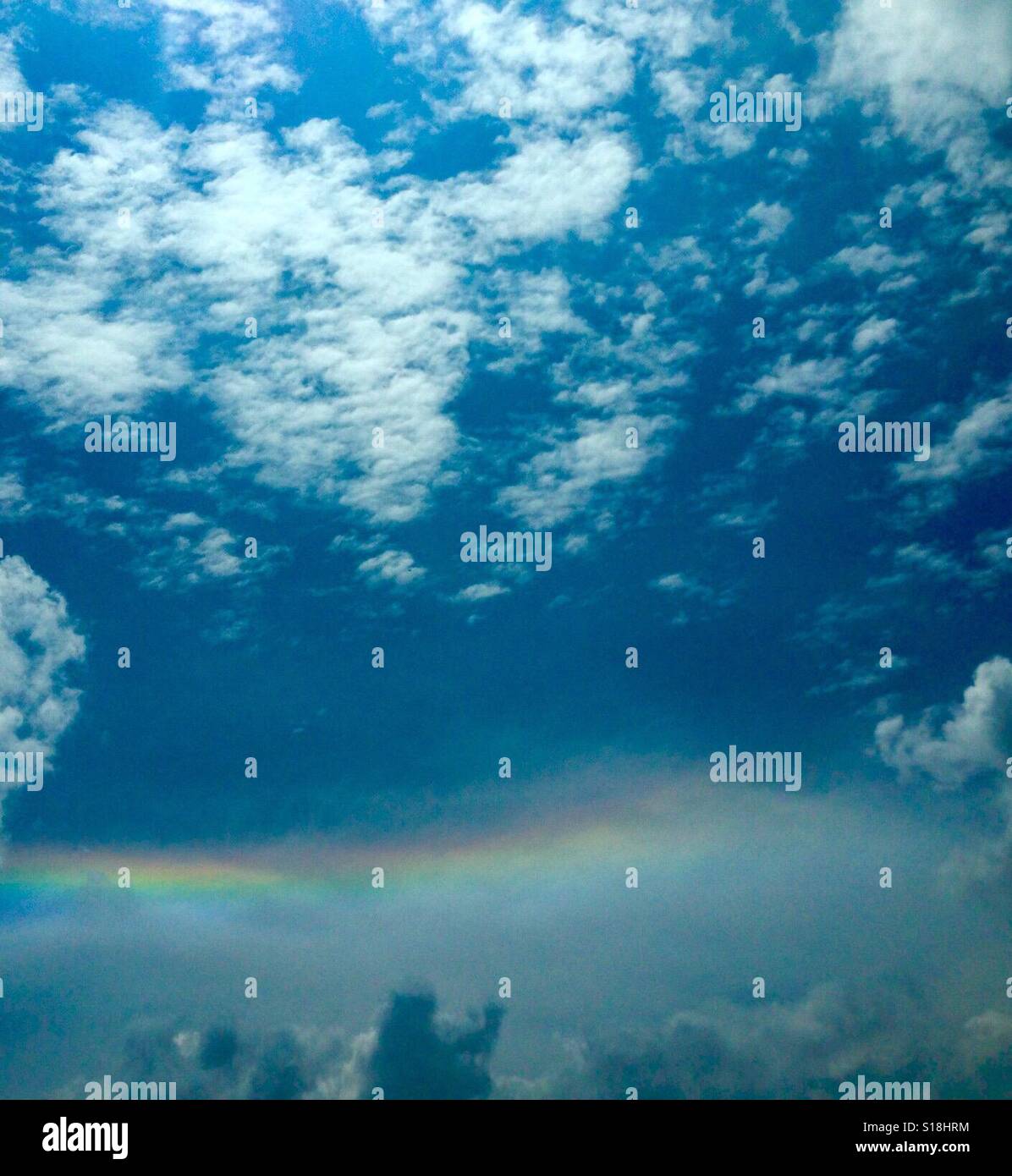 Blue sky with clouds and rainbow hi-res stock photography and images ...