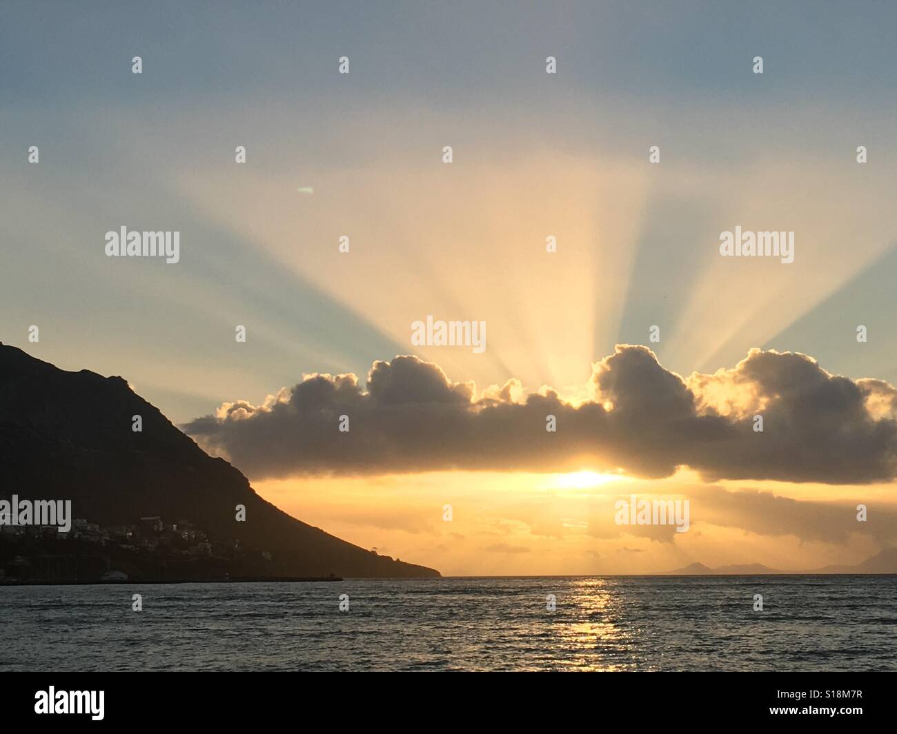 Sun rays at sunset Stock Photo - Alamy