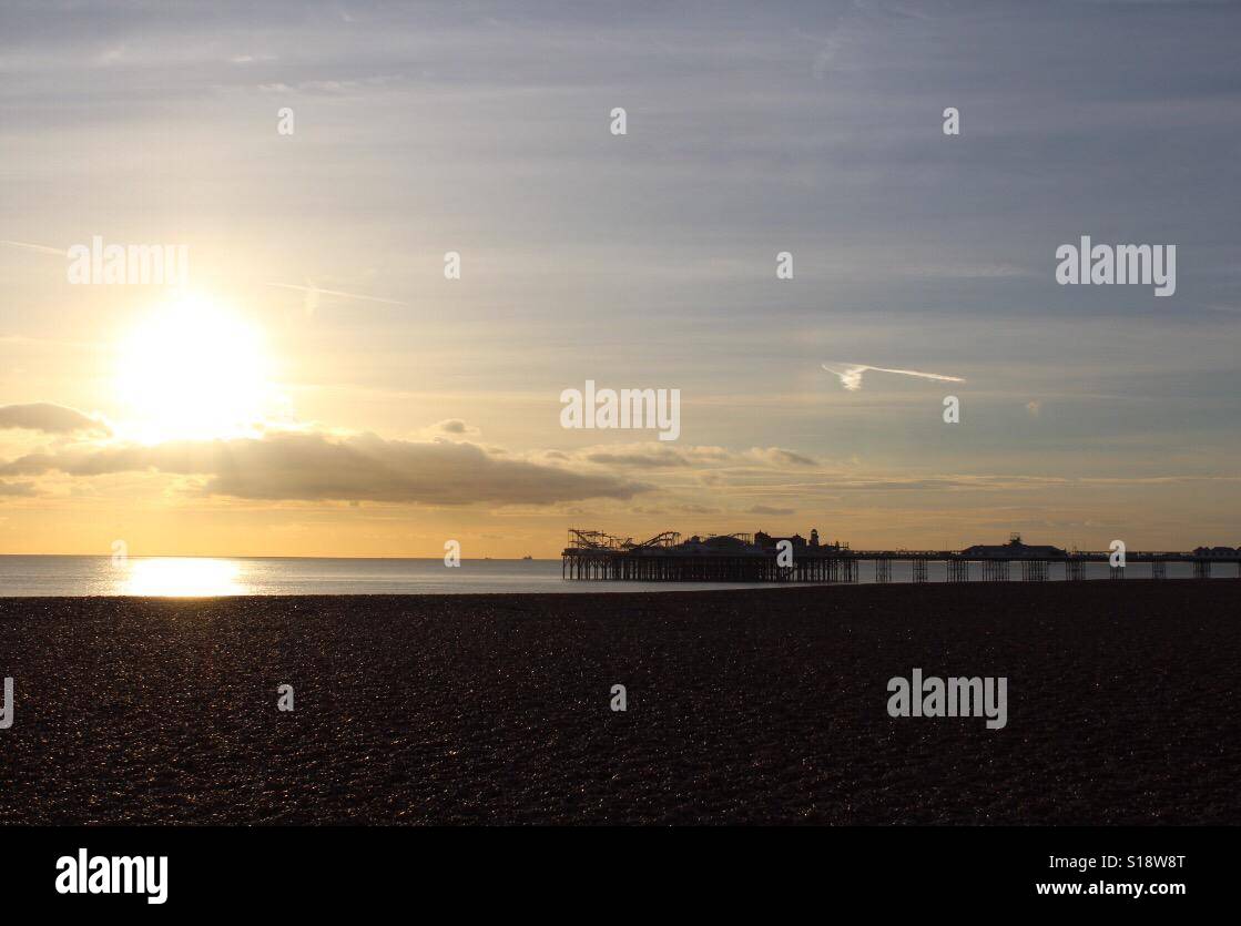 Sunset over Brighton pier Stock Photo - Alamy