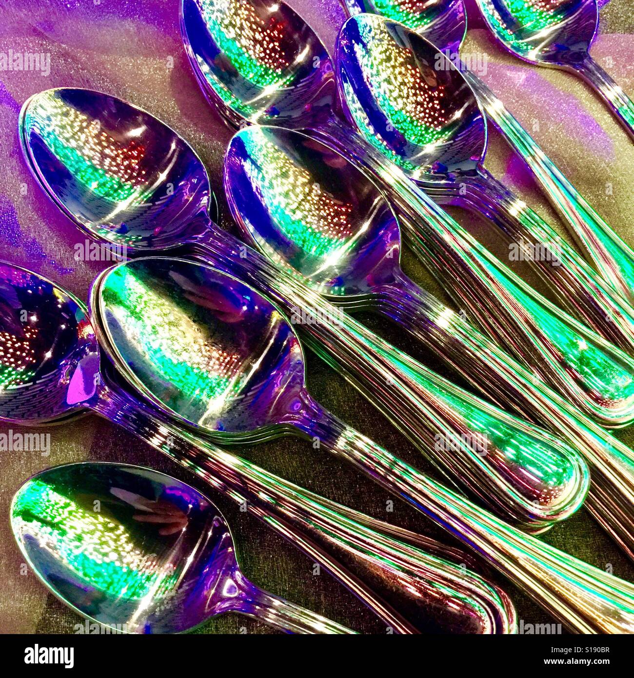 Metal spoons in reflecting light hi-res stock photography and images ...