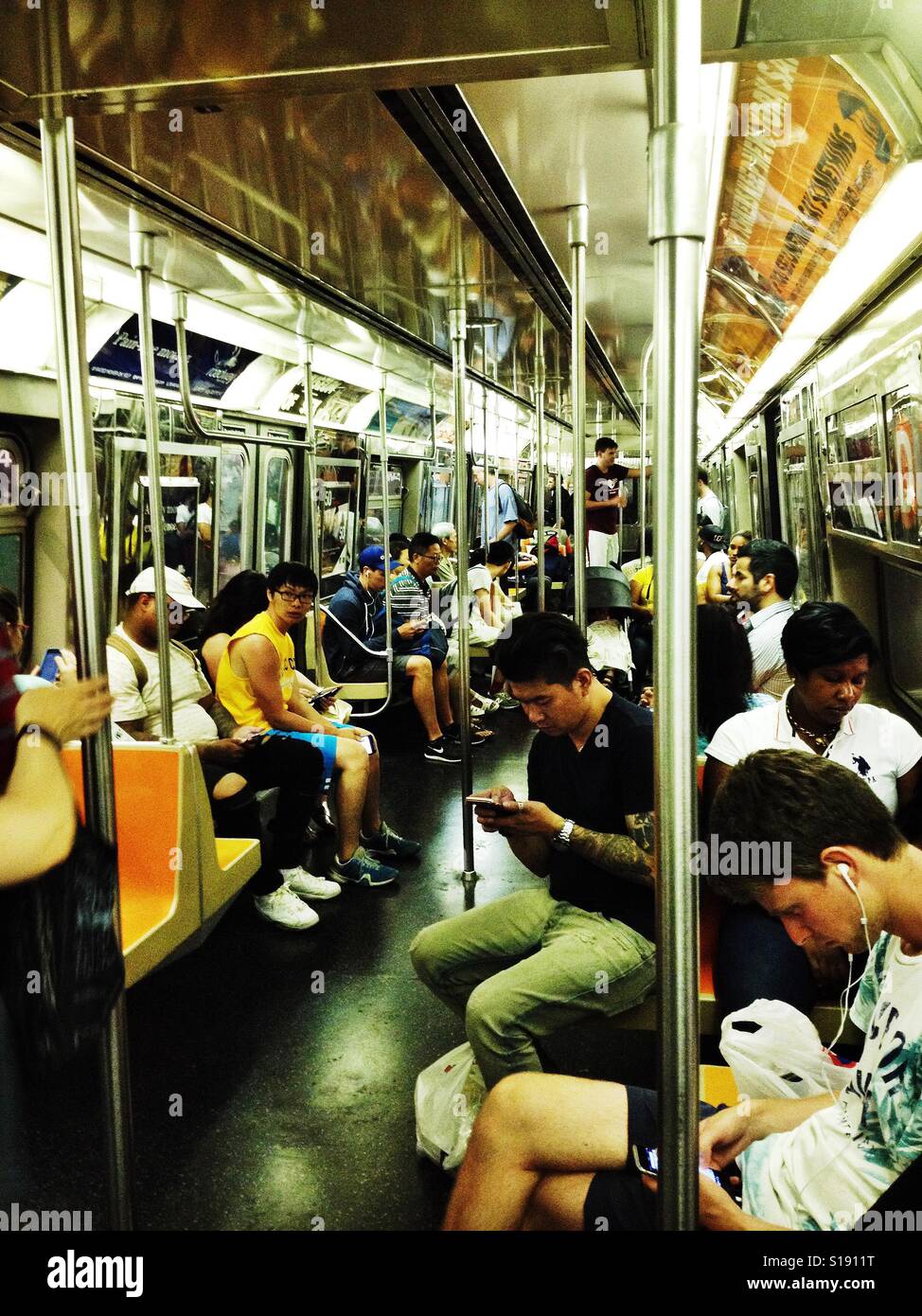Busy New York metro train Stock Photo - Alamy