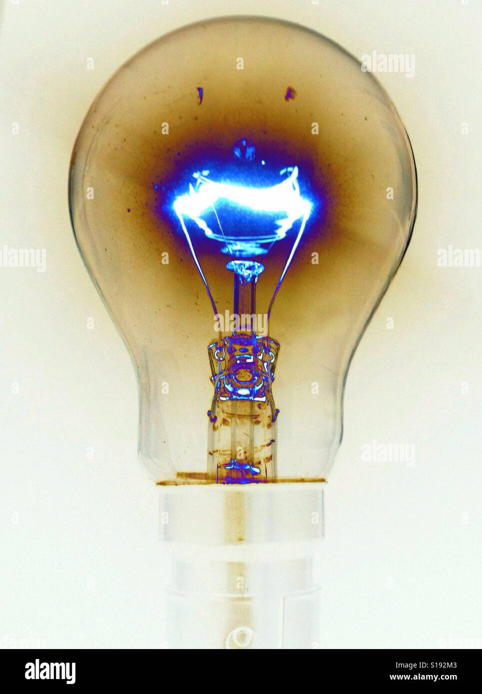 Light bulb with colour inverted Stock Photo - Alamy