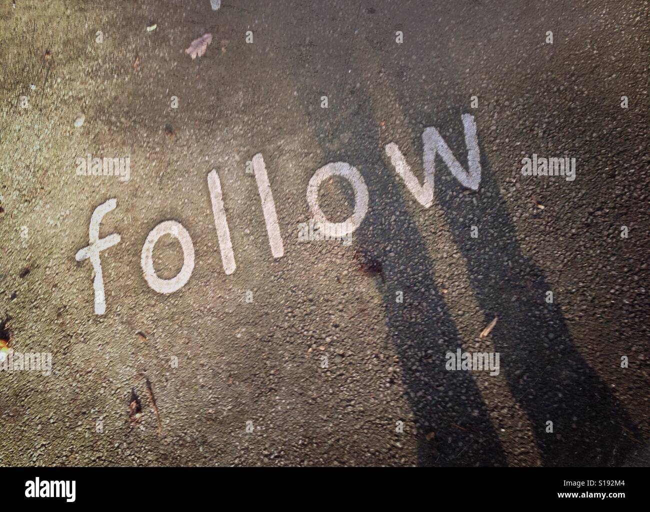 The word follow with silhouette of a person Stock Photo - Alamy