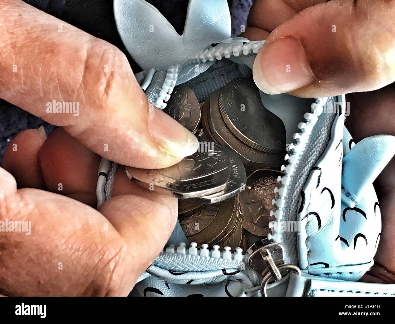 Open purse, full of coins Stock Photo - Alamy