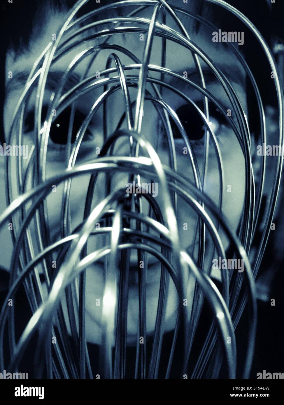 Young boy playfully posing with kitchen whisks makes for a weird ...