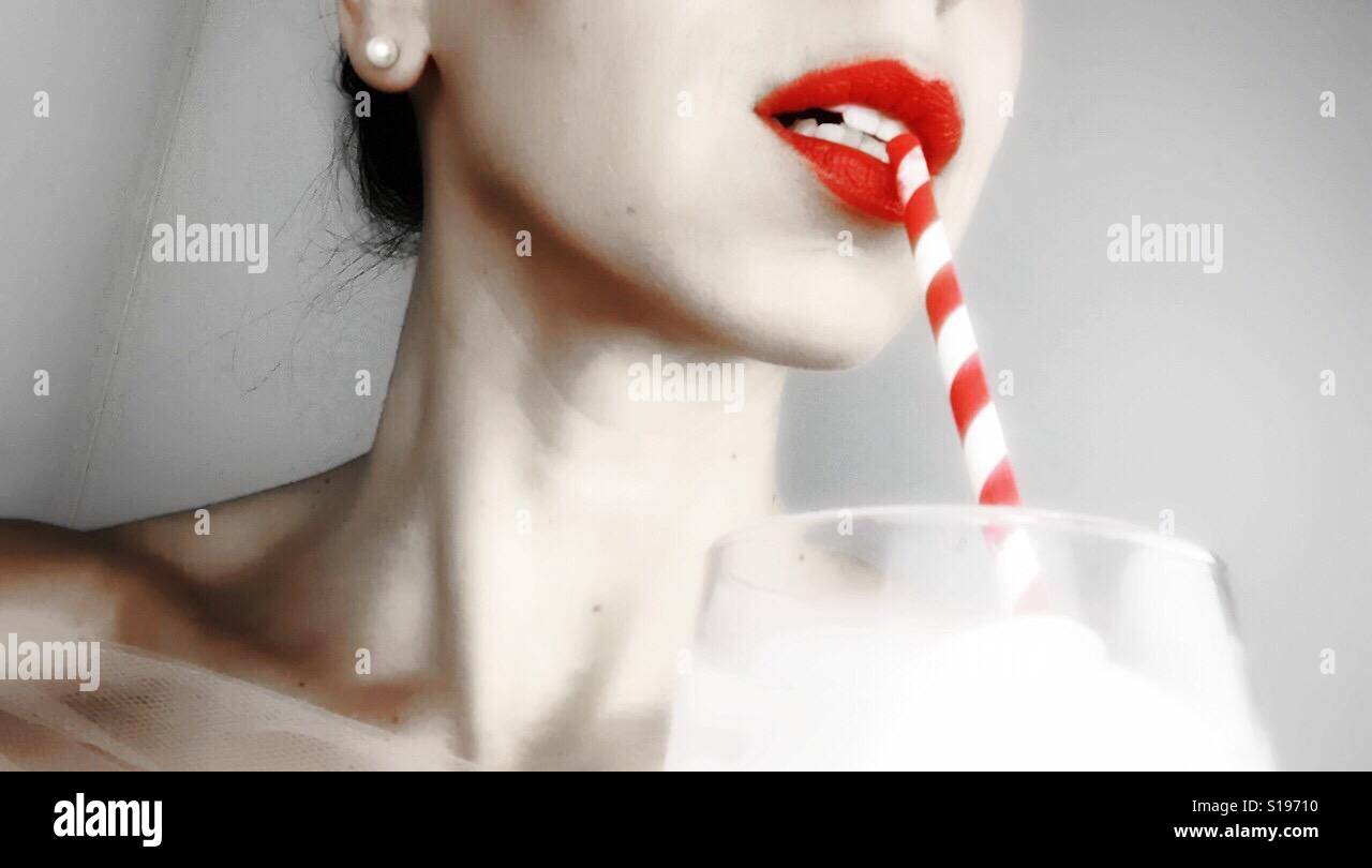 Drinking red straw woman teeth hi-res stock photography and images - Alamy