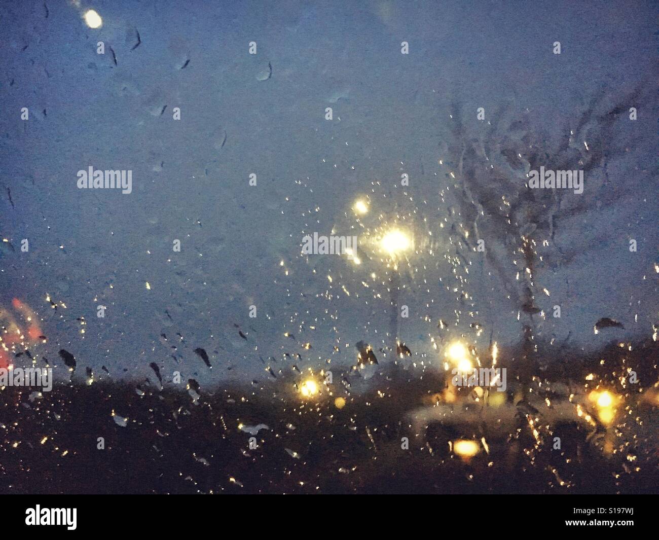 Rainy car park through car window Stock Photo - Alamy