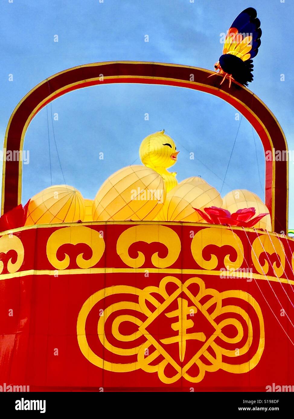 Lanterns of a chick and egg in a basket with a butterfly Stock Photo ...