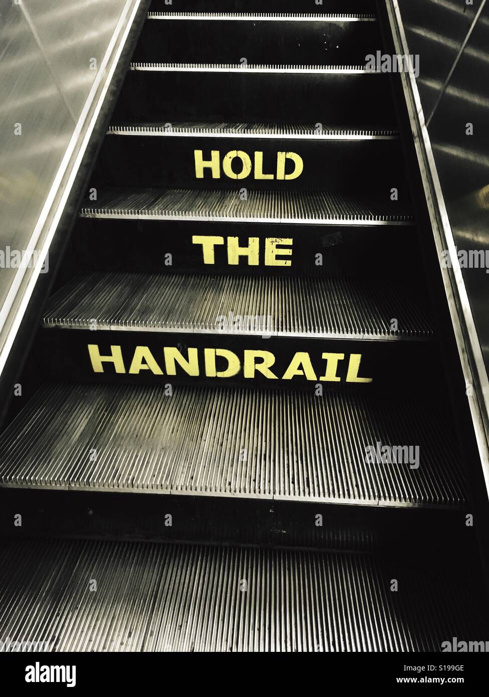 Hold the handrail on a London Underground escalator Stock Photo - Alamy