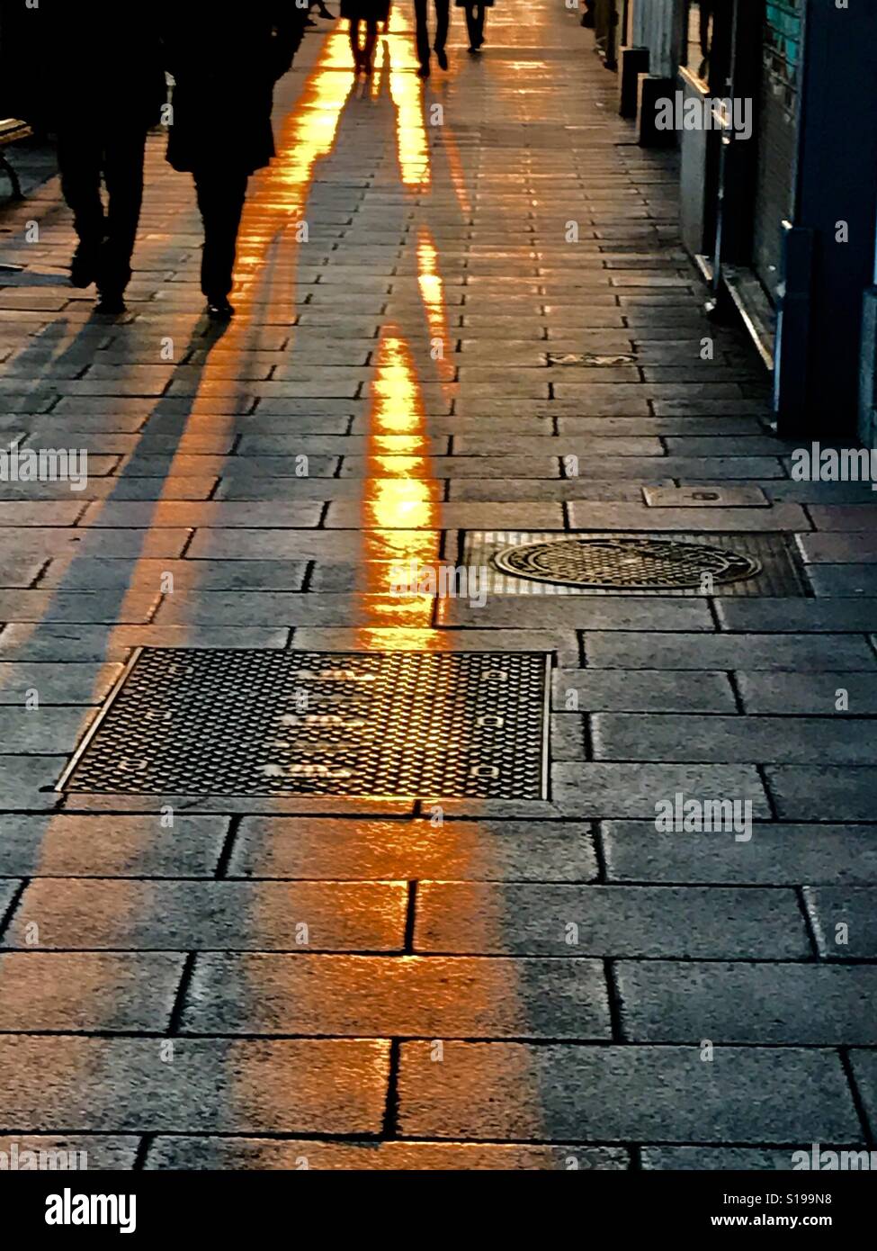 Sunset on pavement Stock Photo - Alamy