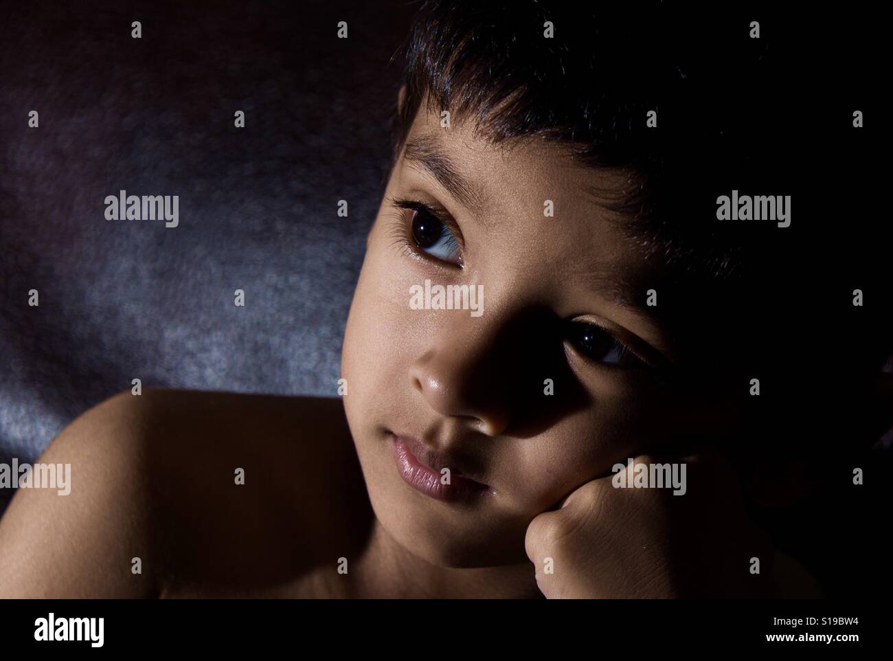 Thinking boy Stock Photo - Alamy